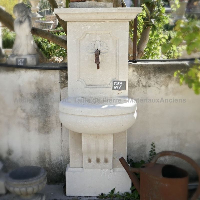 Garden fountain sculpted in natural stone by the stonemason Bidal