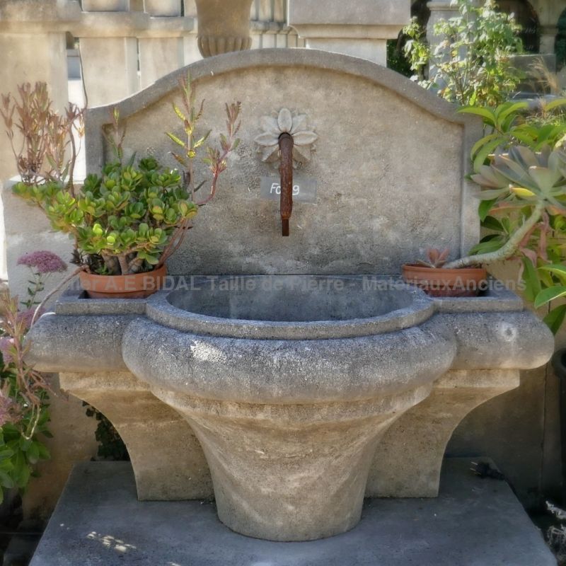 Decorative garden fountain crafted by our stonemason in Provence.