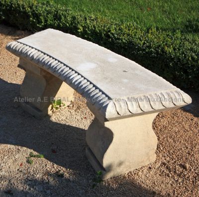 Small carved white limestone bench- Curved garden bench by Alain Bidal