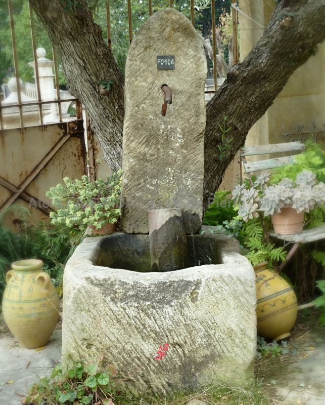 Garden wall fountain - Rustic fountain by Alain Bidal's stone workshop