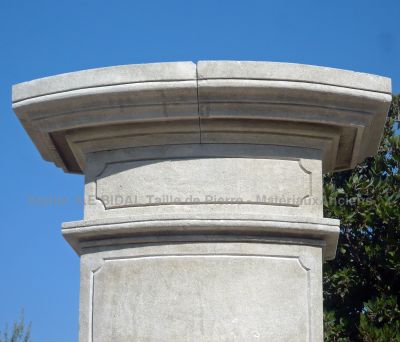 Pair of rectangular pillars in stone with a base