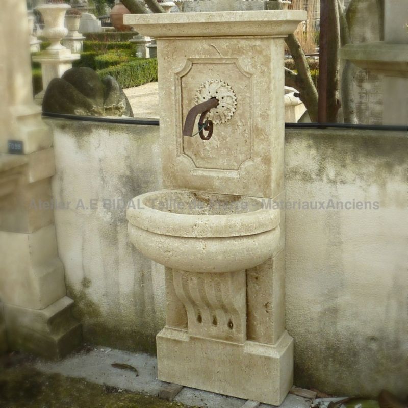 Garden fountain sculpted in natural stone by the stonemason Bidal