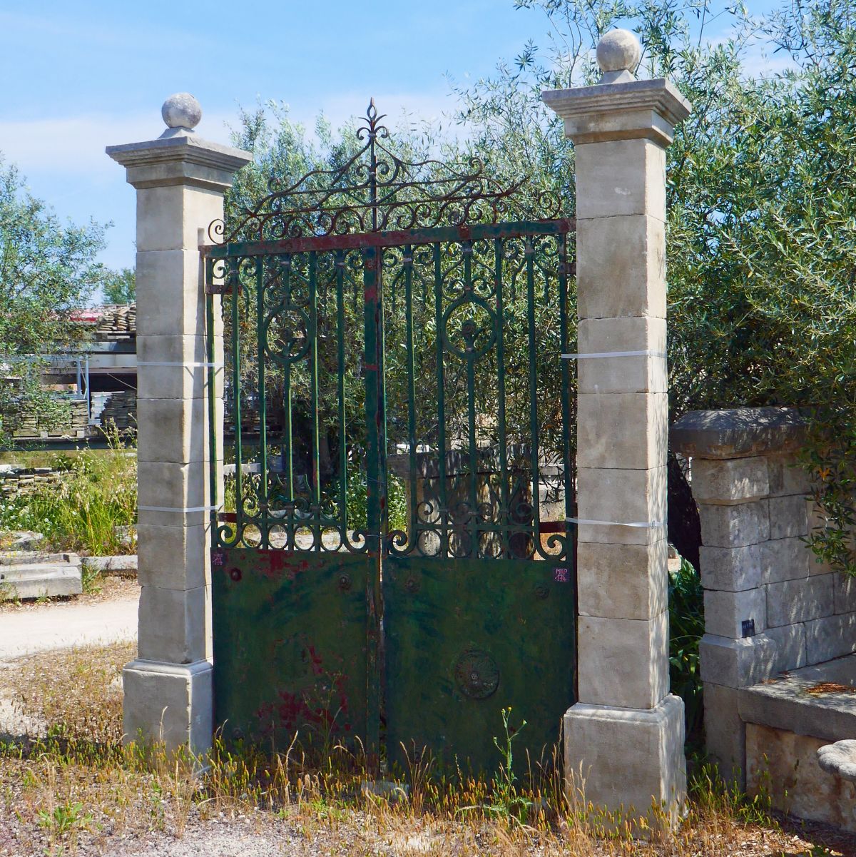 Pair of stone pillars : tall pillars decorated with a ball in stone